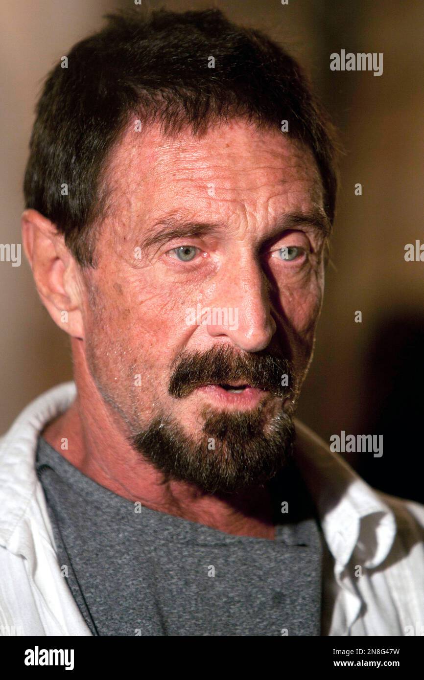 Software company founder John McAfee speaks during an interview at a ...
