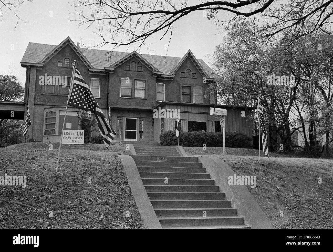 American flags flown upside down and an anti-U.N. sign are shown at the ...