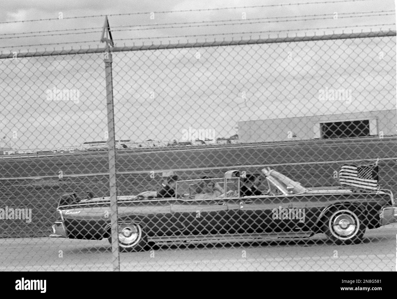 President John F. Kennedy's limousine heads for Air Force One at Brooks ...