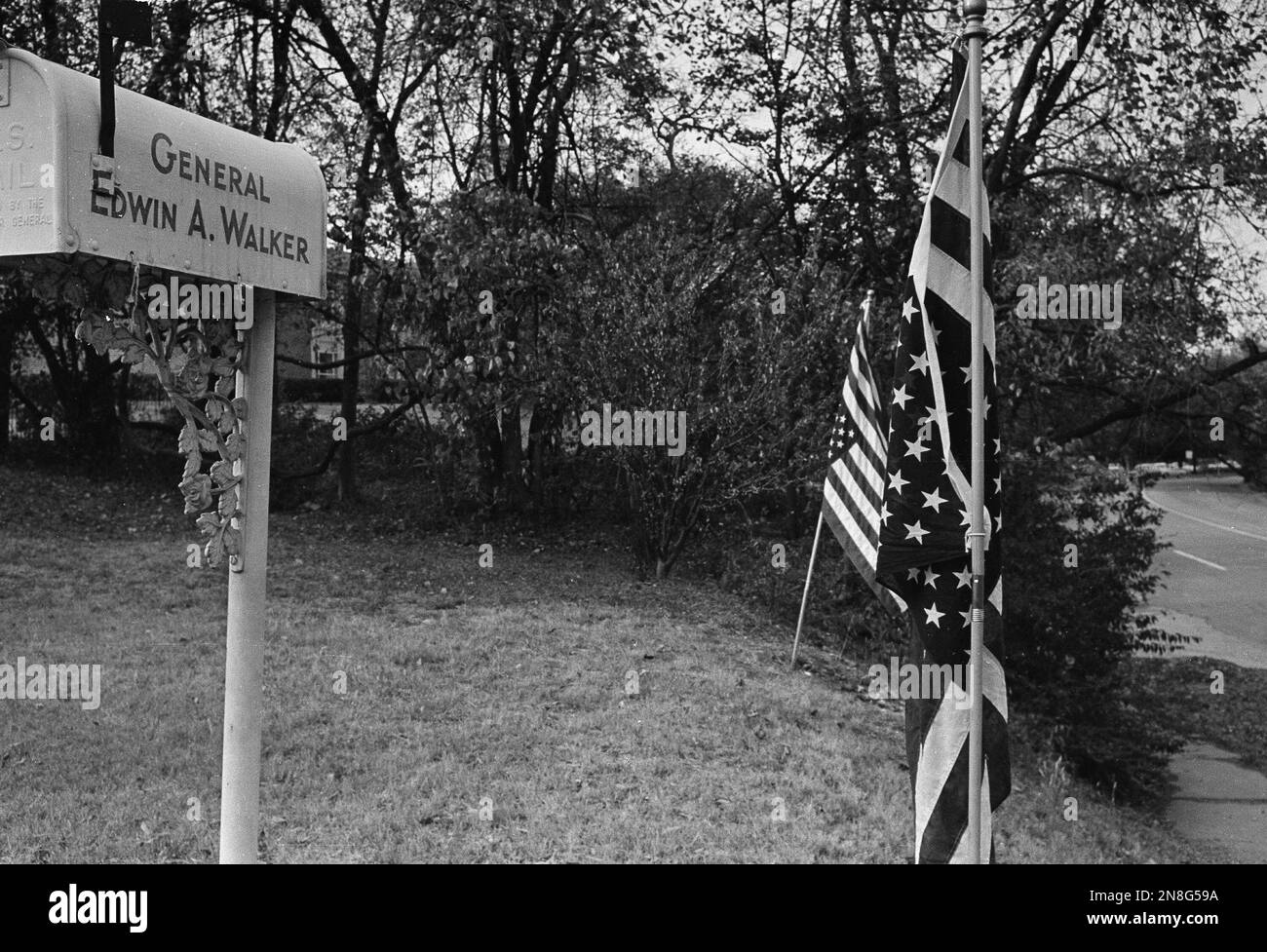 American flags flown upside down are shown on the Dallas, Tex., lawn of ...