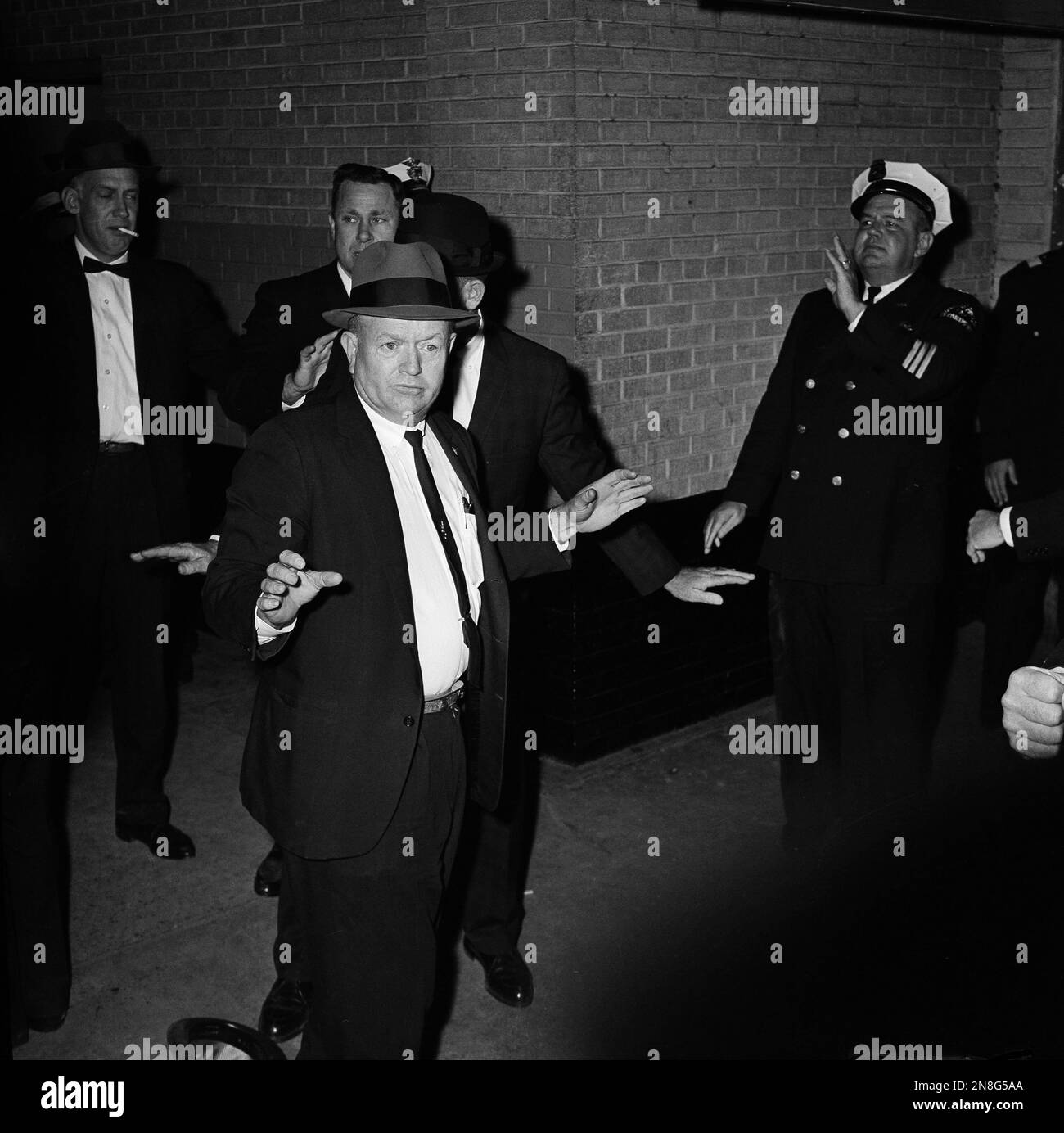 Police and reporters react after the shooting of Lee Harvey Oswald ...