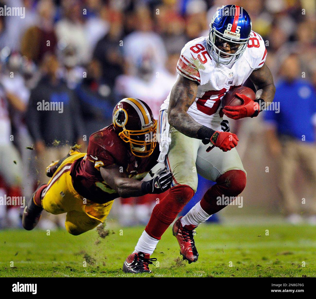 Washington Redskins inside linebacker London Fletcher reaches to stop ...