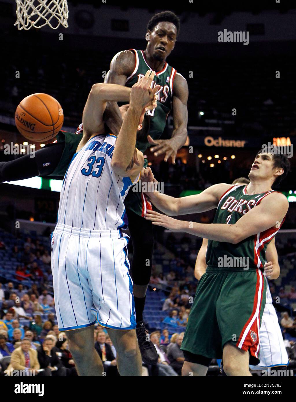 New Orleans Hornets forward Ryan Anderson (33) is fouled by Milwaukee ...