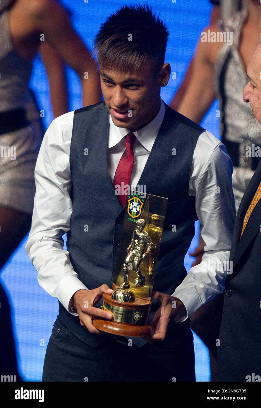 Santos' soccer player Neymar holds up the trophy for best striker ...