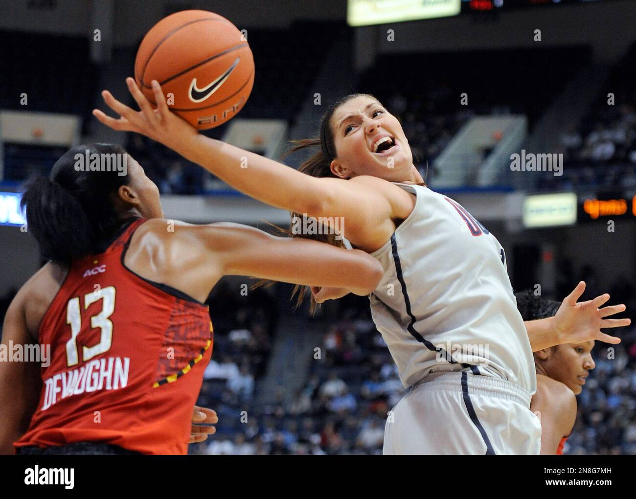 Connecticut's Stefanie Dolson, right, reaches back to grab a pass as ...