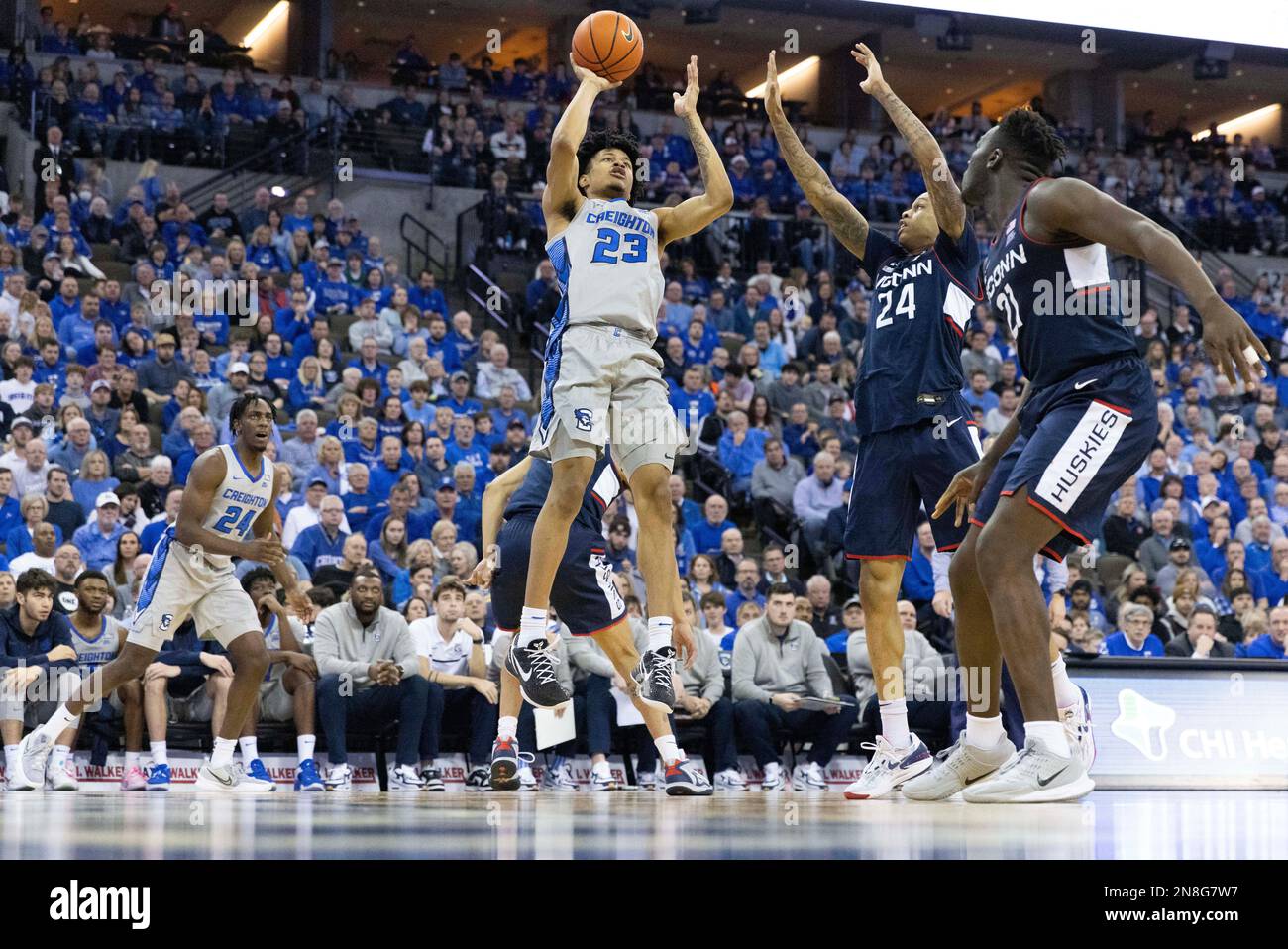 Creighton's Trey Alexander (23) shoots against UConn's Jordan Hawkins ...