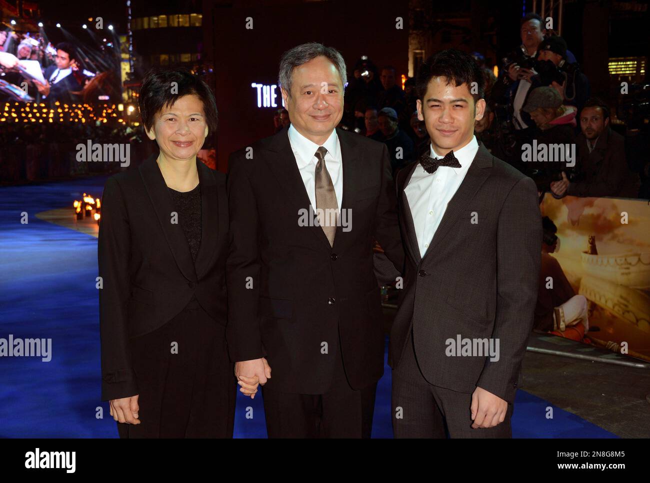 Ang Lee, centre, with wife Jane Lin, left, and son Mason Lee seen at ...