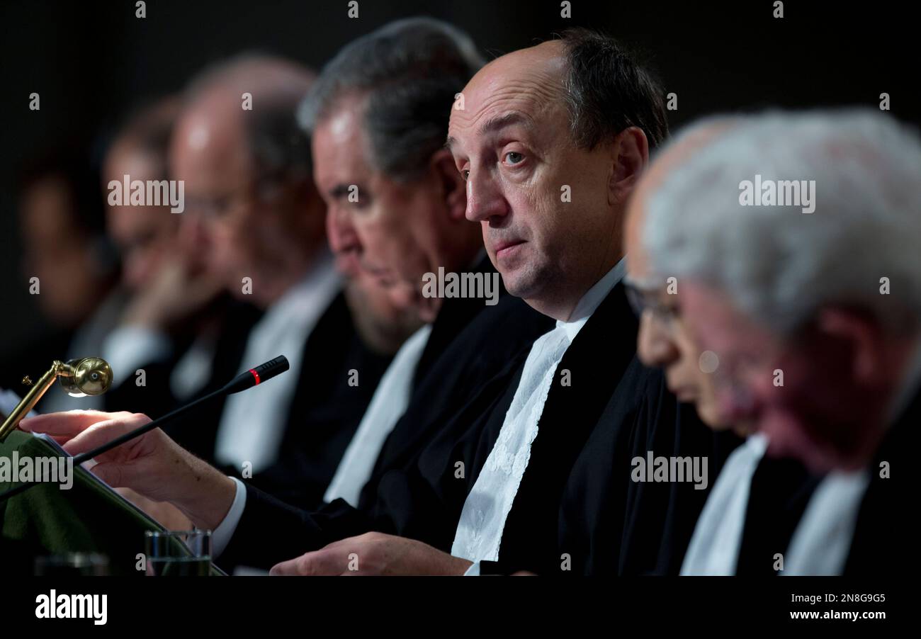 Presiding judge Tomka, third from right, opens the hearings in a ...