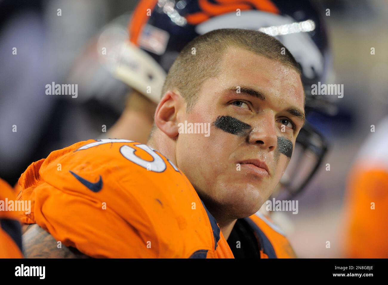 Denver Broncos defensive end Derek Wolfe (95) looks at the score board ...