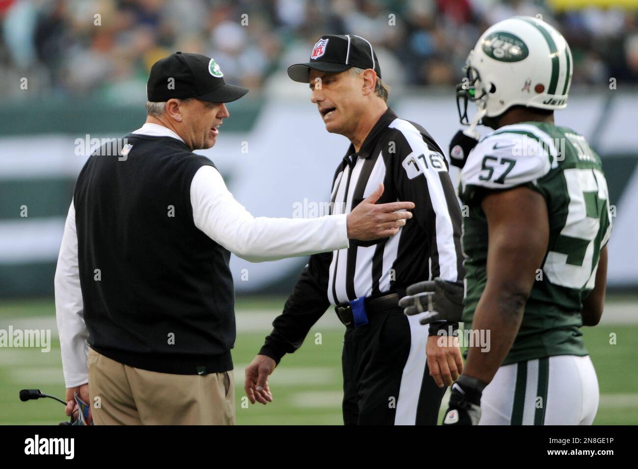 New York Jets head coach Rex Ryan, left, talks to side judge Mike ...