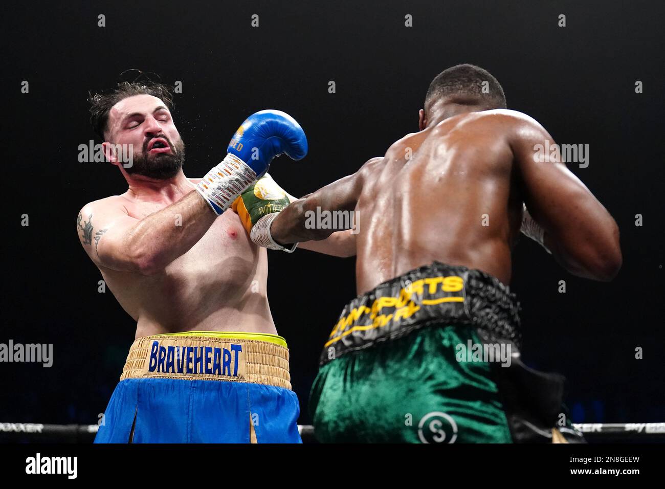 Anees Taj (left) is struck by Viddal Riley in the Cruiserweight contest ...