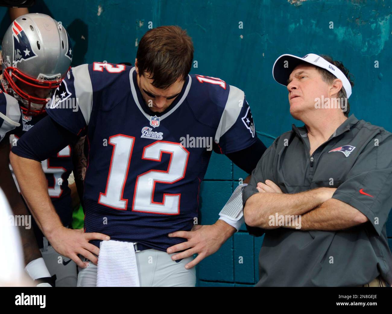 New England Patriots head coach Bill Belichick, right, speaks to ...