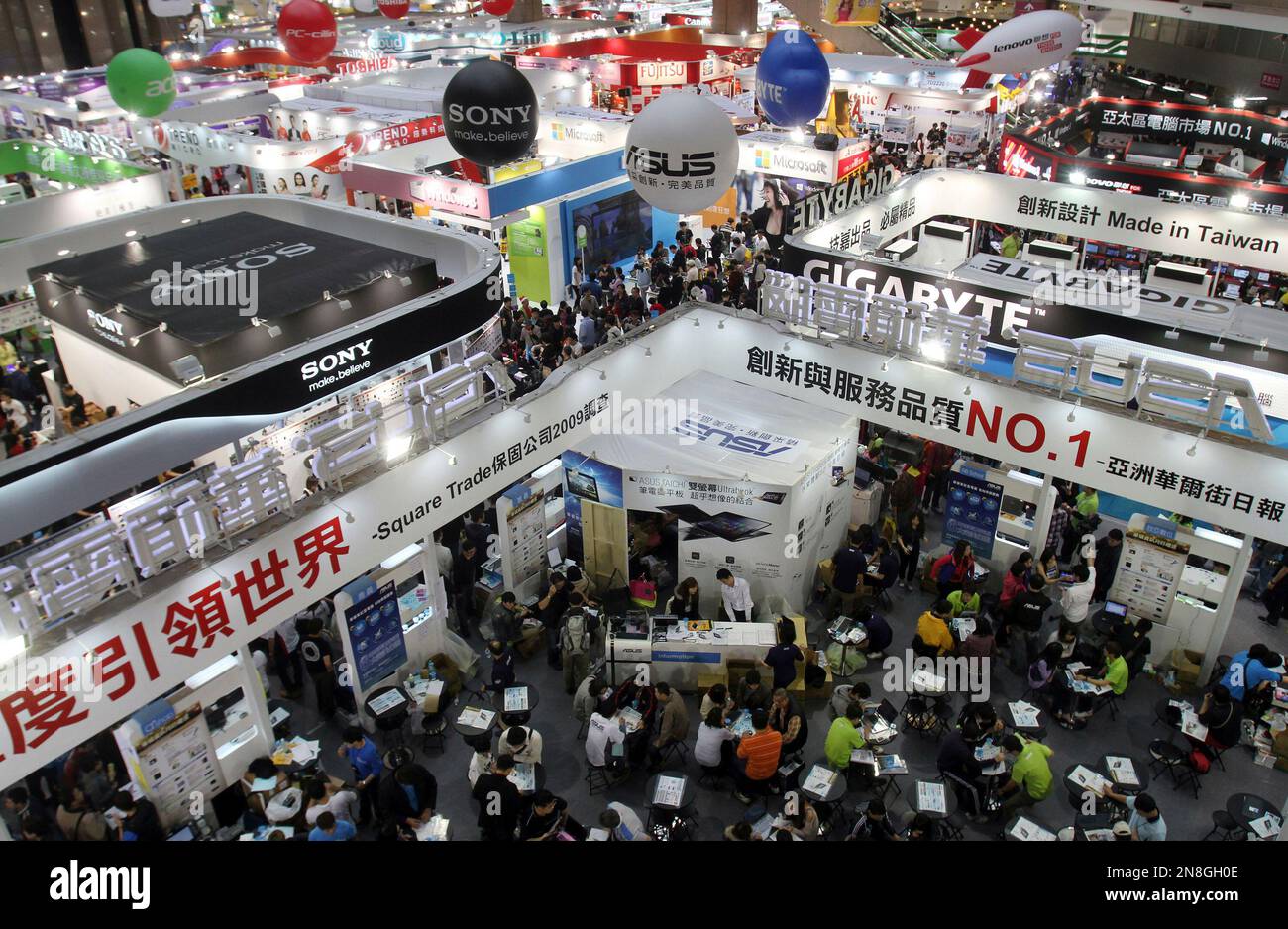 People visit at the ICT Month tech fair at the Taipei World Trade ...