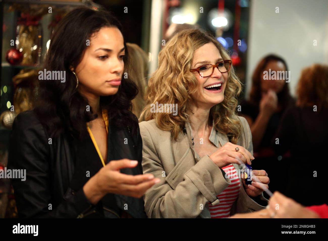 Actress Kyra Sedgwick, right, and actress Rochelle Aytes mix custom ...