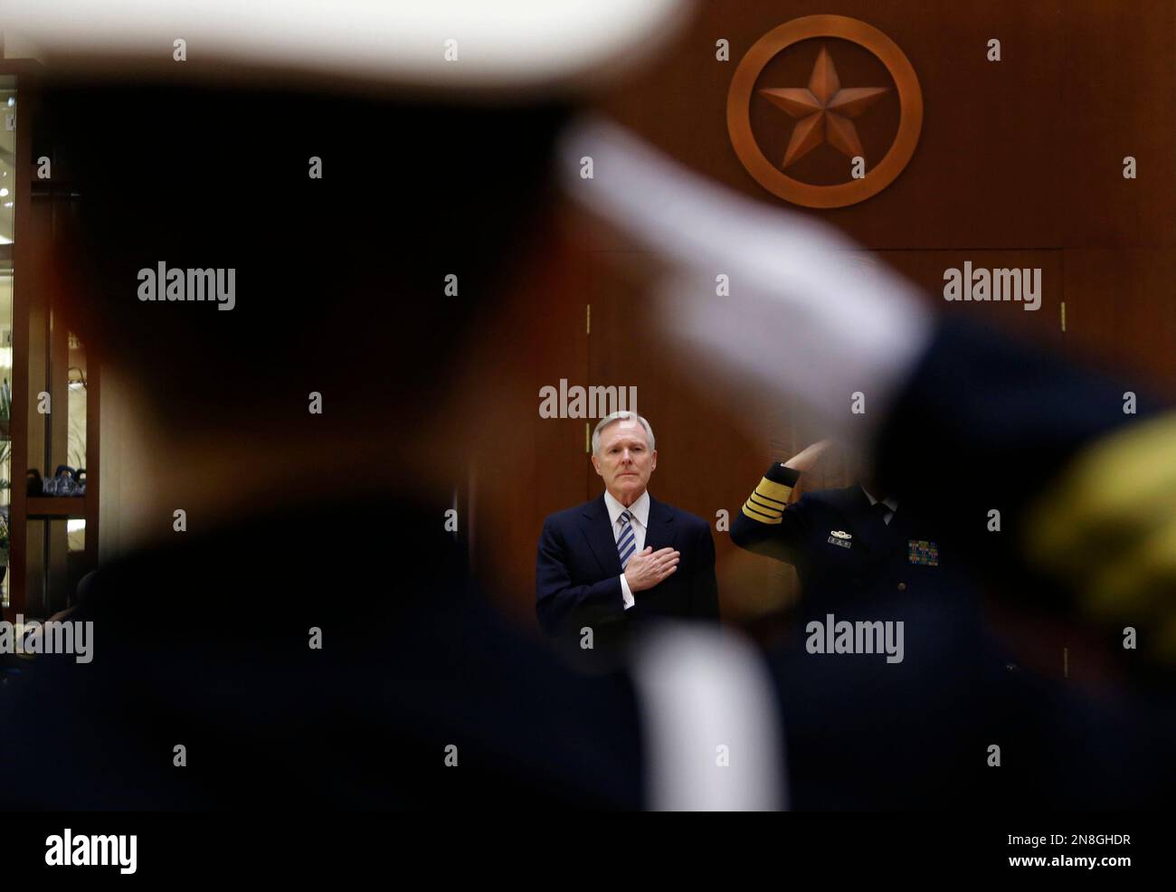 In this Nov. 27, 2012 photo, U.S. Navy Secretary Ray Mabus, center, and ...