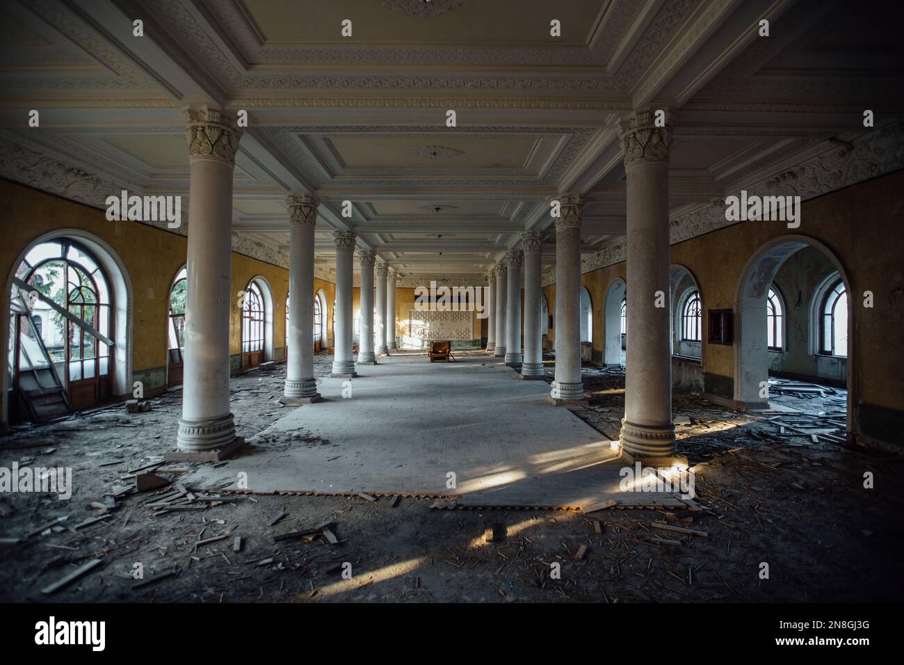 Large hall with columns in old abandoned mansion Stock Photo - Alamy