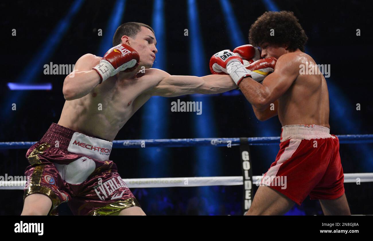 Jayson Velez, left, of Puerto Rico, lands a punch on the face of ...