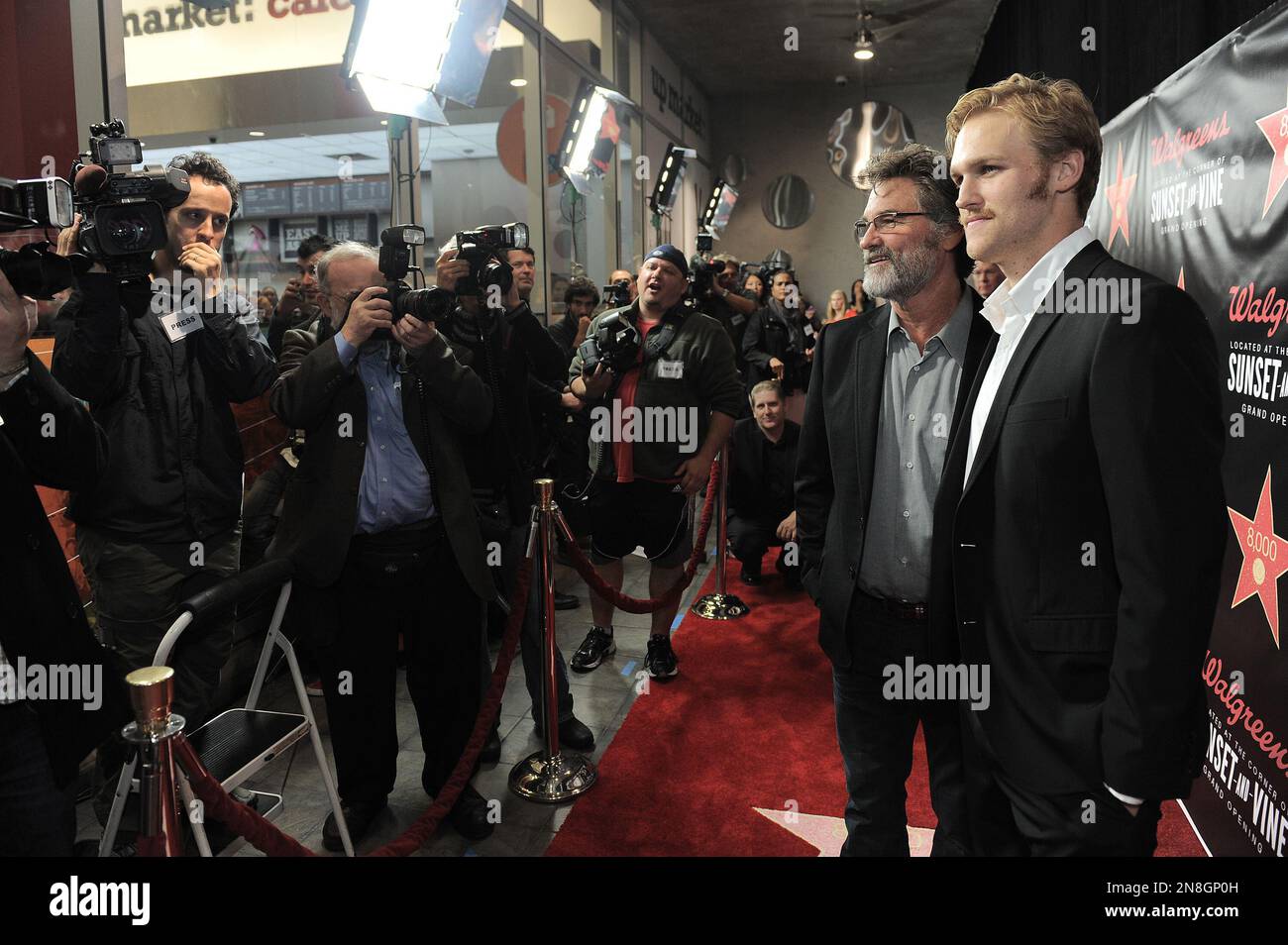 From left, Kurt Russell and Wyatt Russell attend Walgreens 8000th Store ...