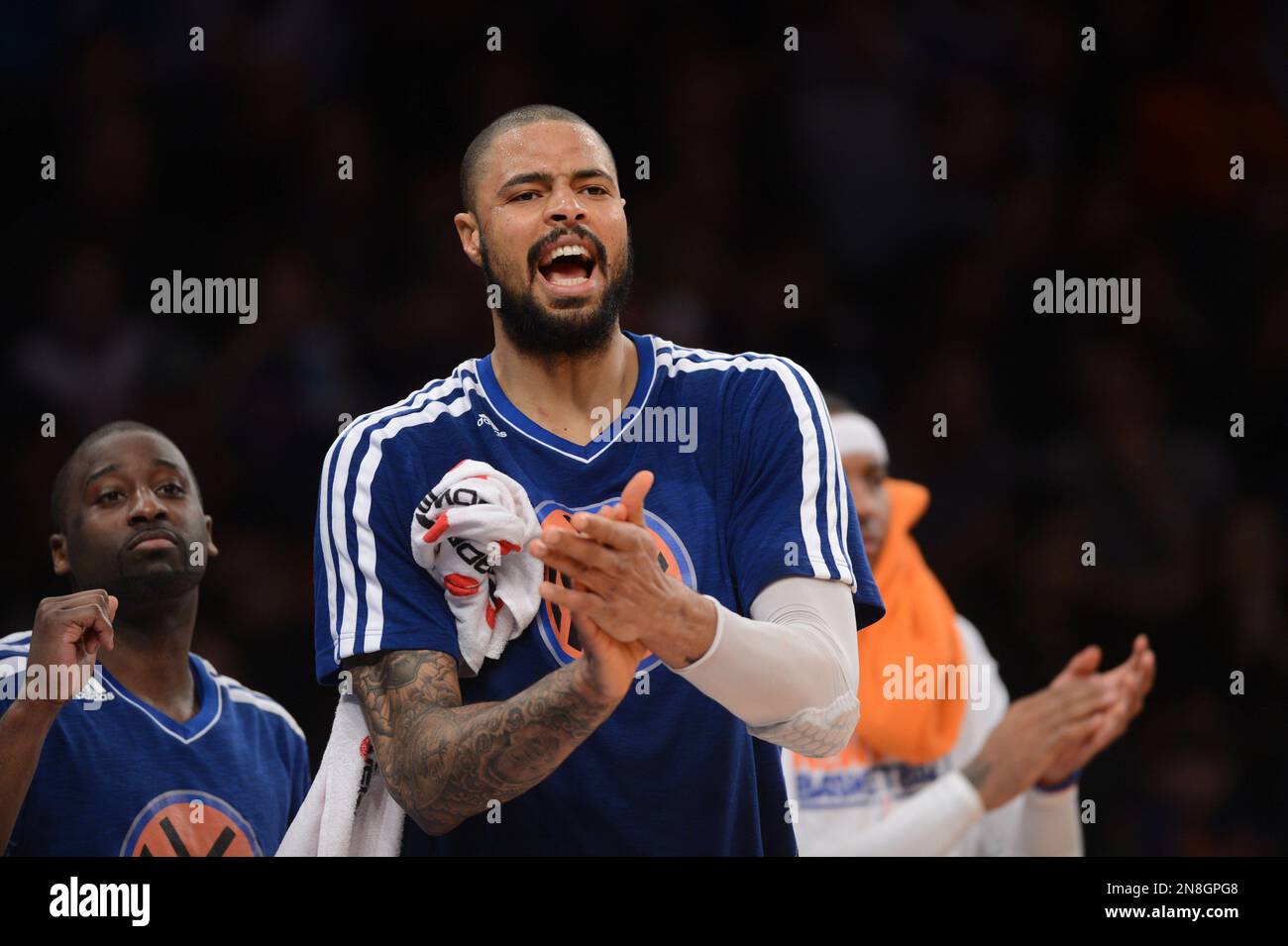 New York Knicks' Tyson Chandler, center, and Raymond Felton cheer on ...