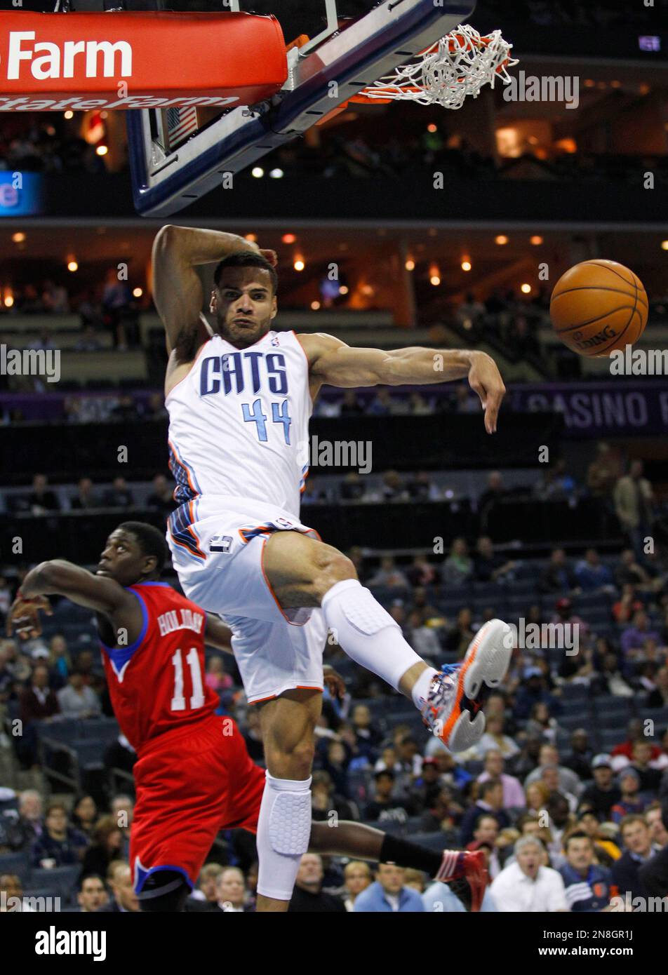 Charlotte Bobcats' Jeffery Taylor (44) dunks over Philadelphia 76ers ...
