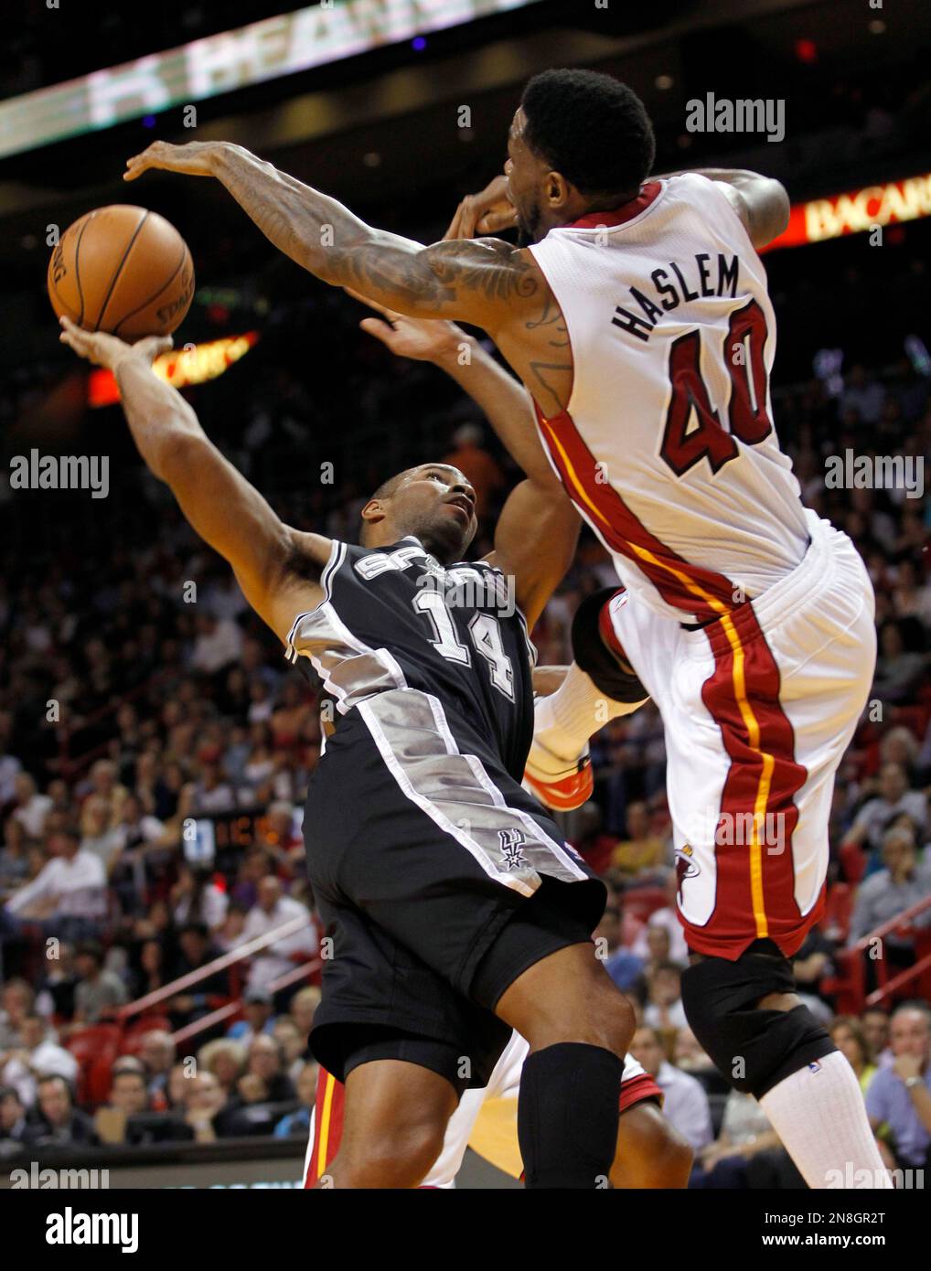 San Antonio Spurs' Gary Neal (14) is fouled by Miami Heat's Udonis ...