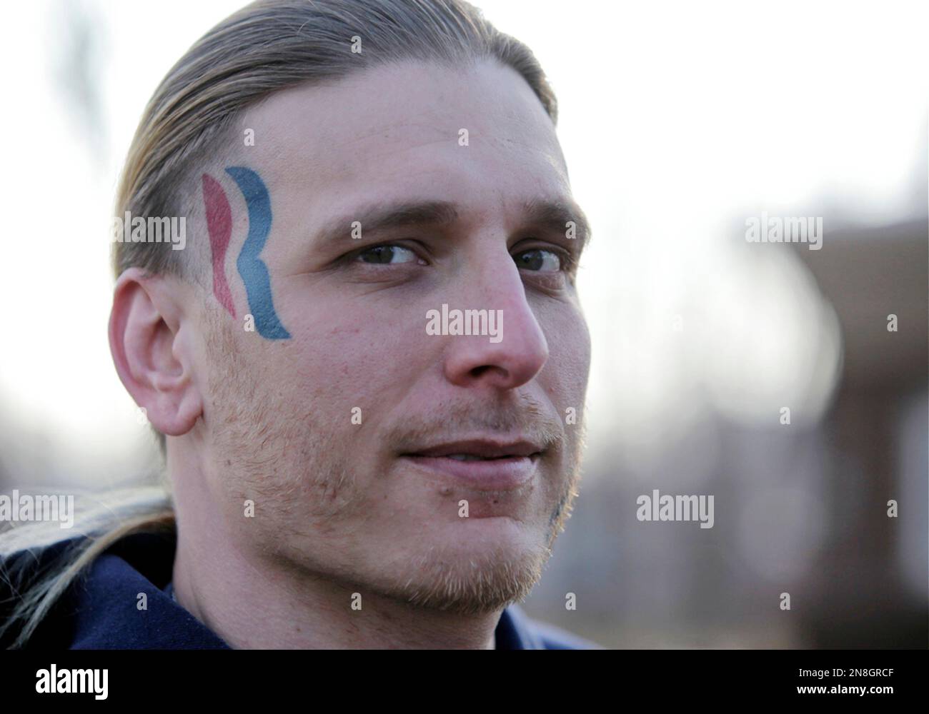 Eric Hartsburg, 30, poses for a photo showing his Romney-Ryan election ...