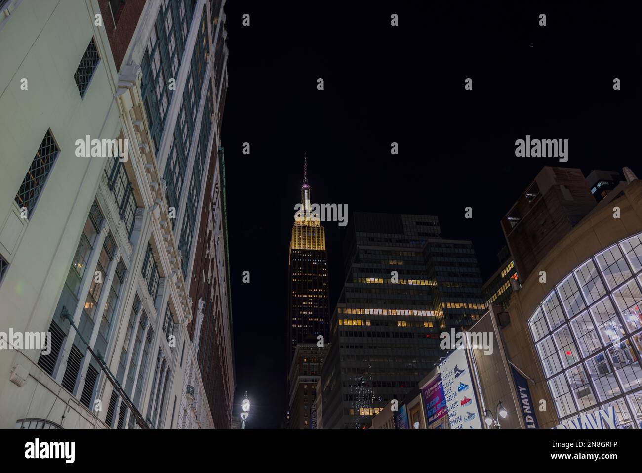 Beautiful night view of top of Empire State Building skyscraper between ...