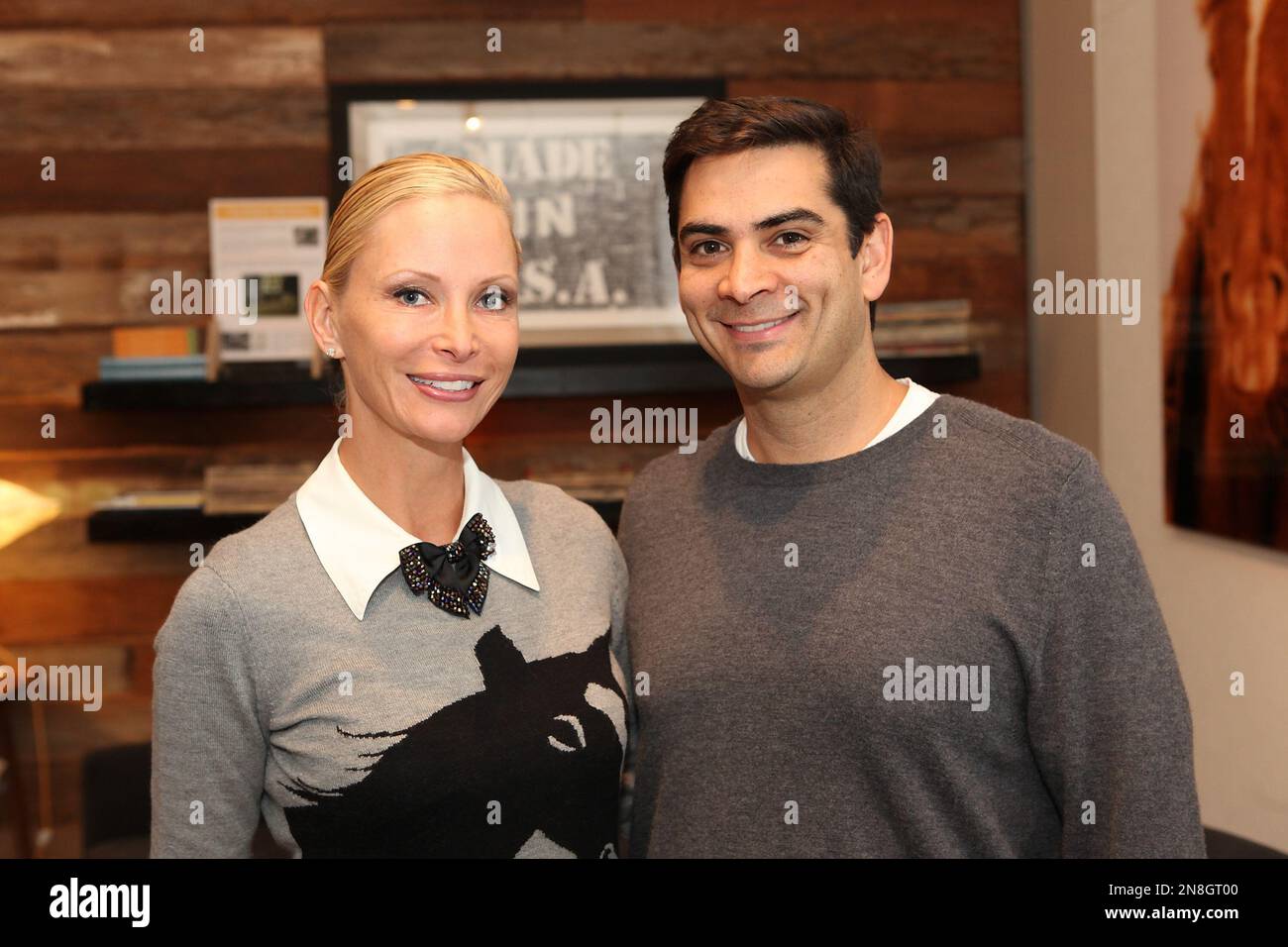 From left, Nicole Bhathal and Alex Bhathal pose during a book signing ...