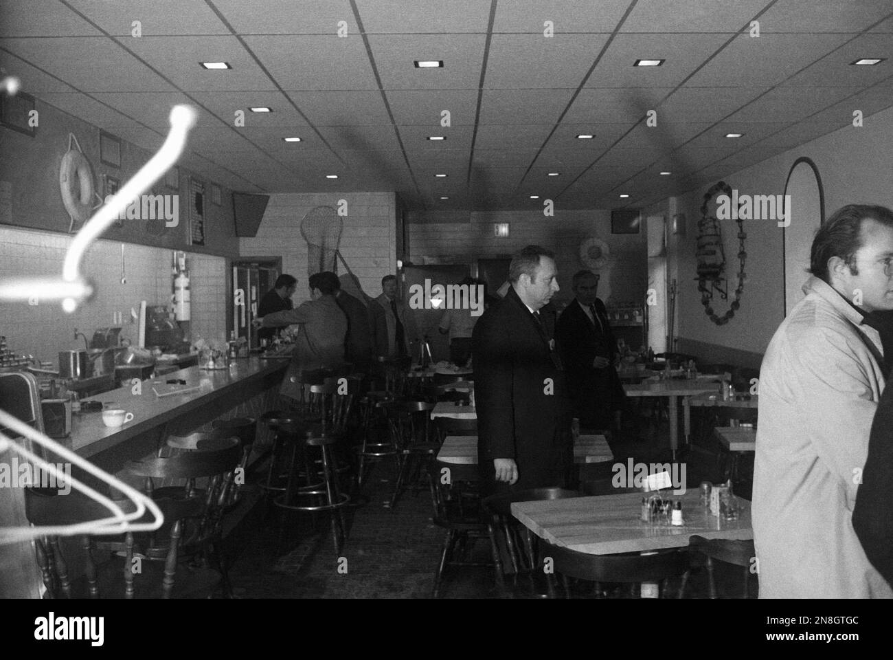 New York City police detectives inspect the dining room at Umberto's ...