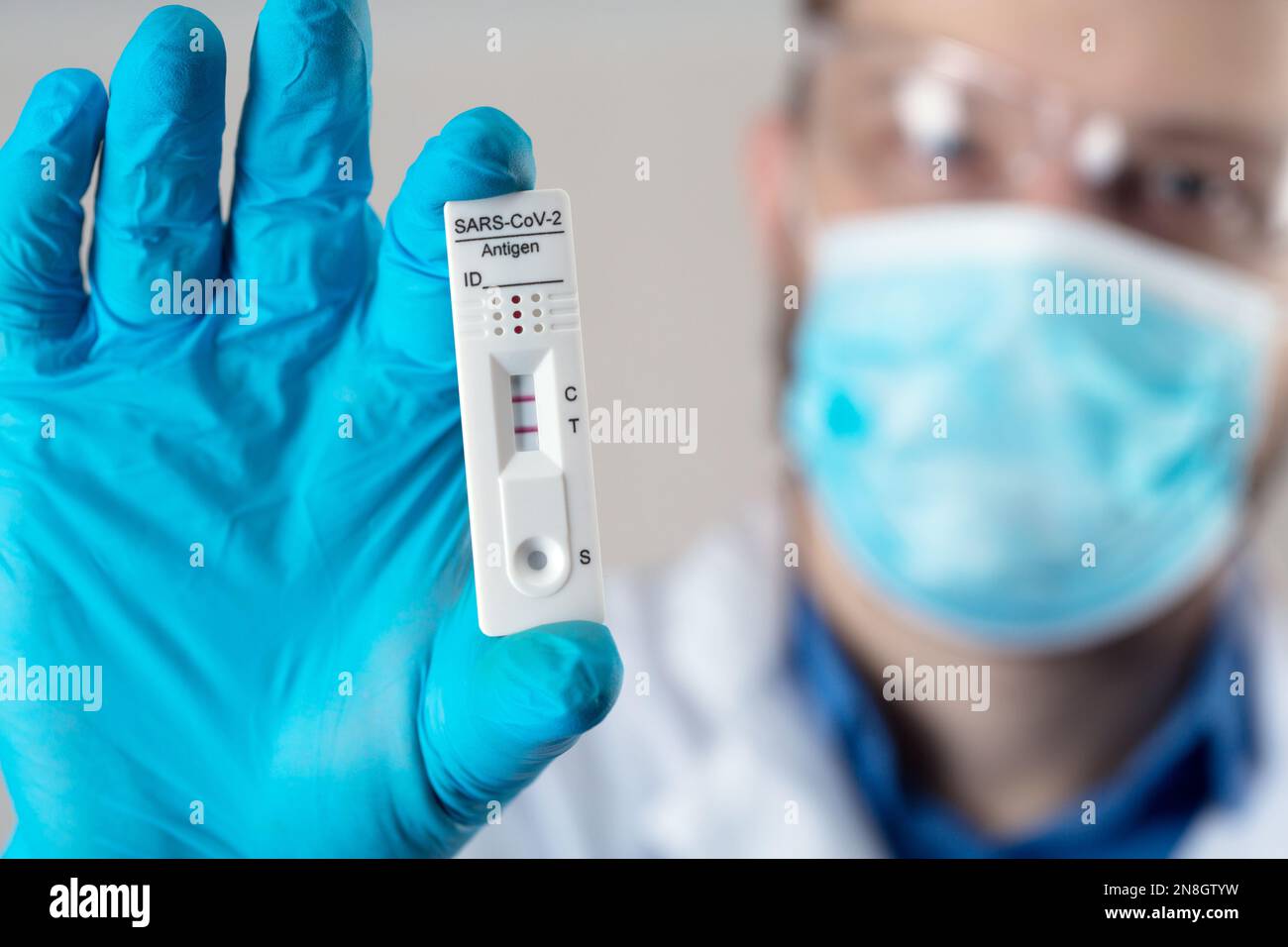 Express corona test. Positive covid antigen test Stock Photo - Alamy