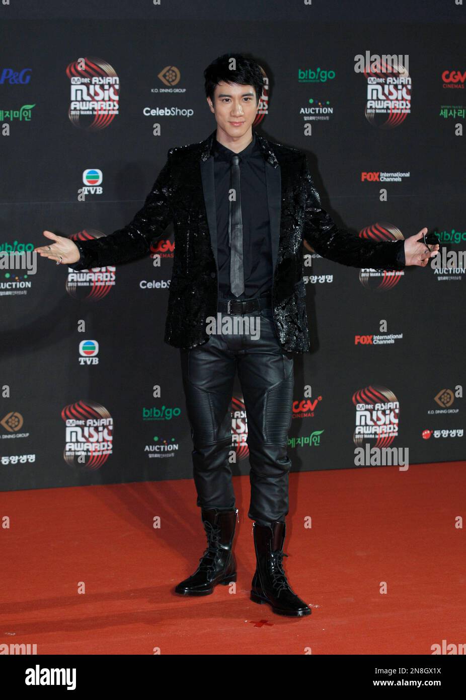 American-Taiwanese actor-singer Wang Leehom poses for photographers at ... American-Taiwanese actor-singer Wang Leehom poses for photographers at ...
