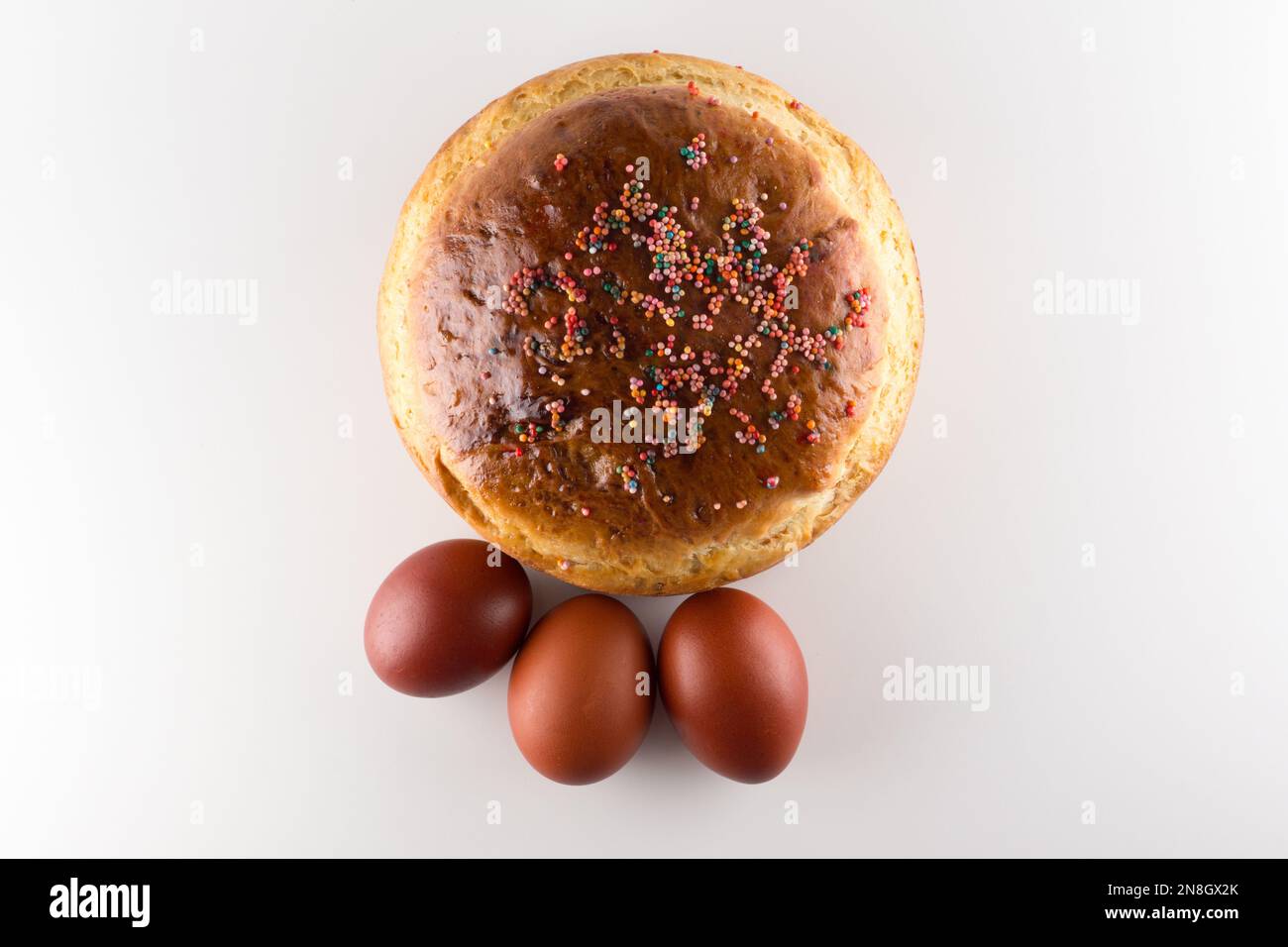 round fragrant Easter bun with colored sprinkles Stock Photo - Alamy