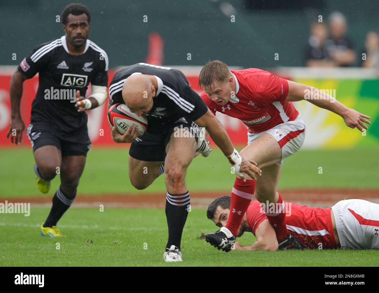 Wales' James Davies, 2nd right, chases New Zealand's DJ Forbes during ...