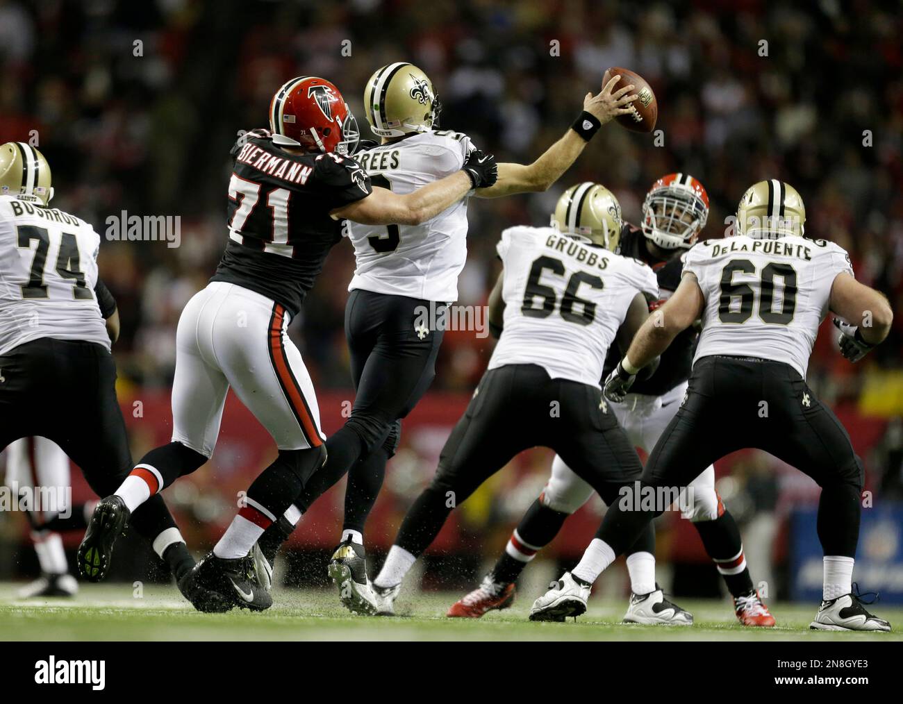 Atlanta Falcons defensive end Kroy Biermann (71) grabs the arm of New ...