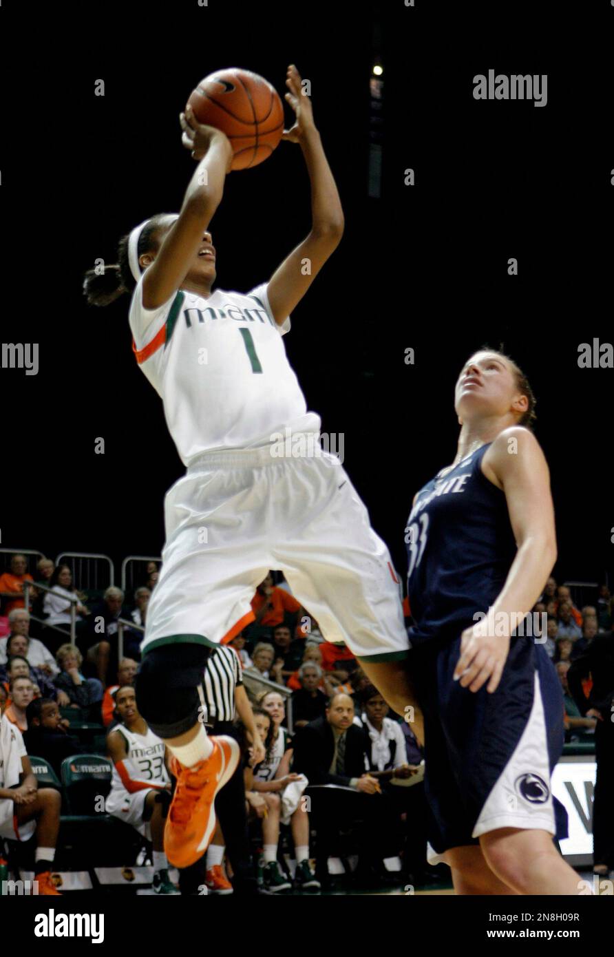 Miami's Caprice Dennis (1) shoots against Penn State's Maggie Lucas ...