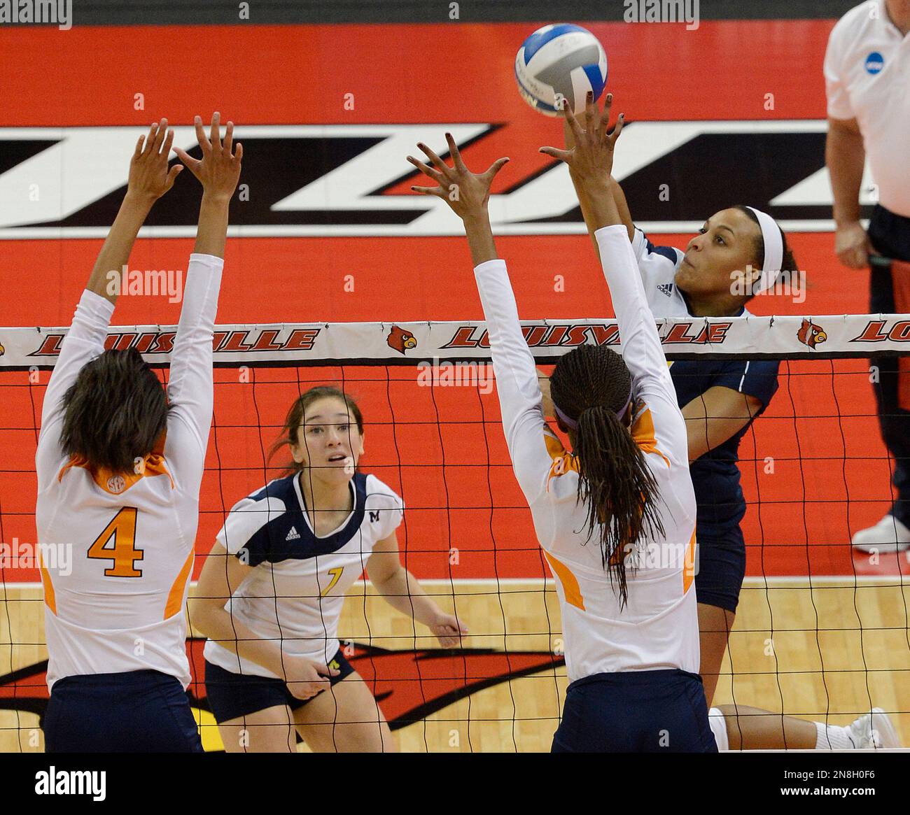 Michigan's Molly Toon, right, attempts to score over the defense of ...
