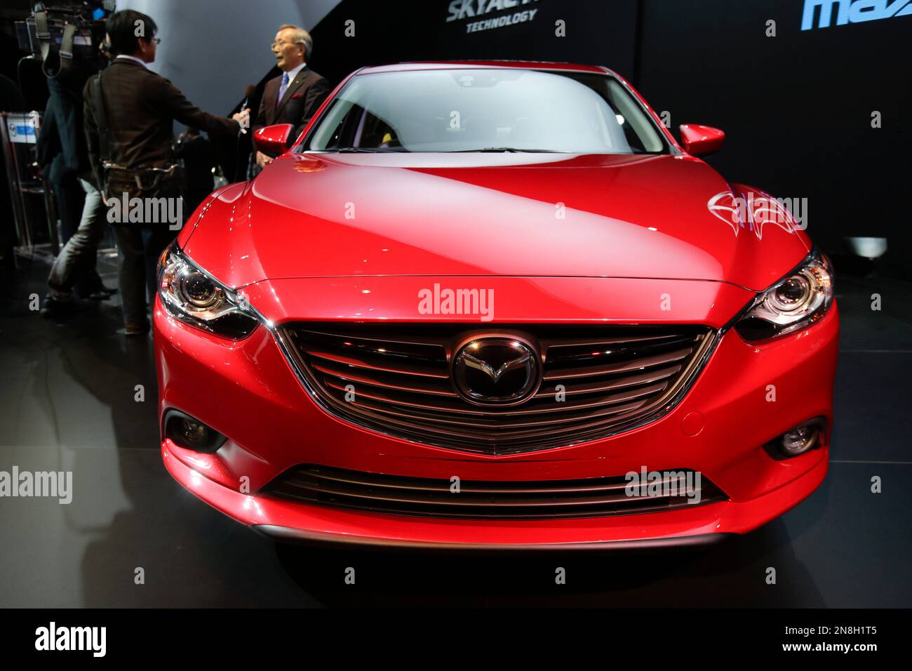 Mazda CEO Takashi Yamanouchi is interviewed while the Mazda6 is shown ...