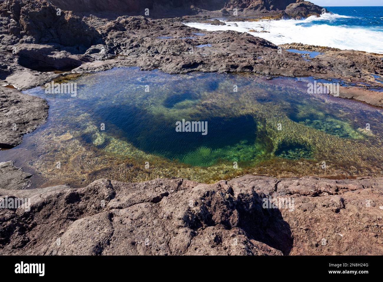 Underwater Wonders: An underwater eroded rock bridge on the ocean's ...