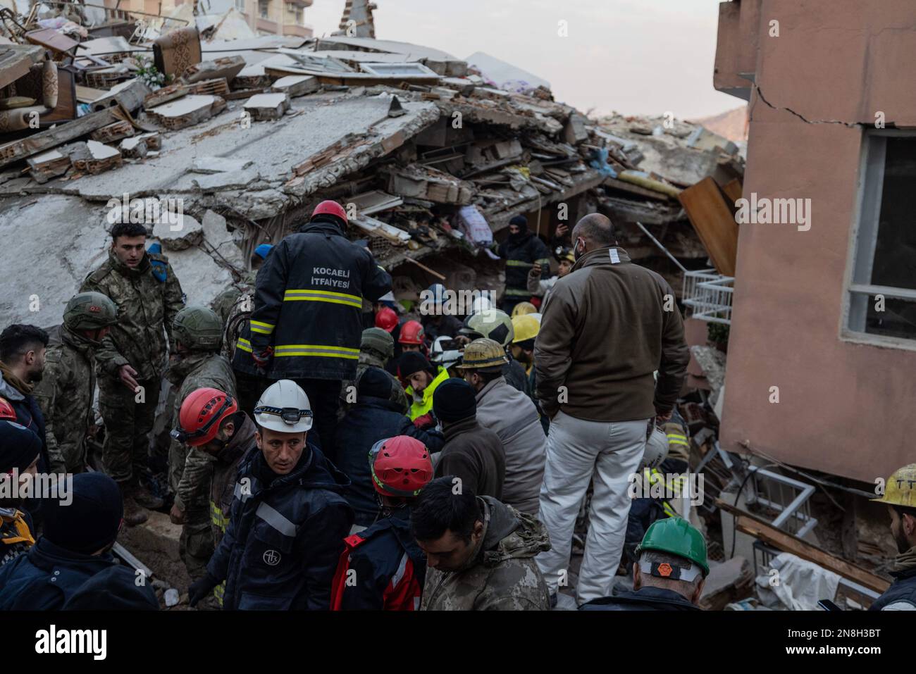 Adana, Turkey, Turkey. 11th Feb, 2023. A father rejoices after his ...