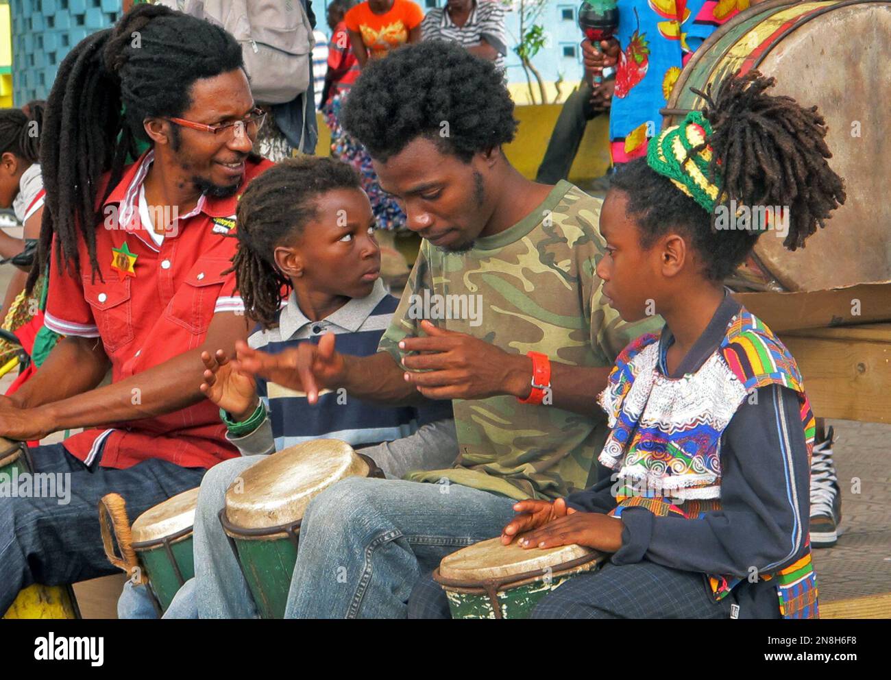 In this Nov. 17, 2012 photo, young and old Rastafarian adherents play ...
