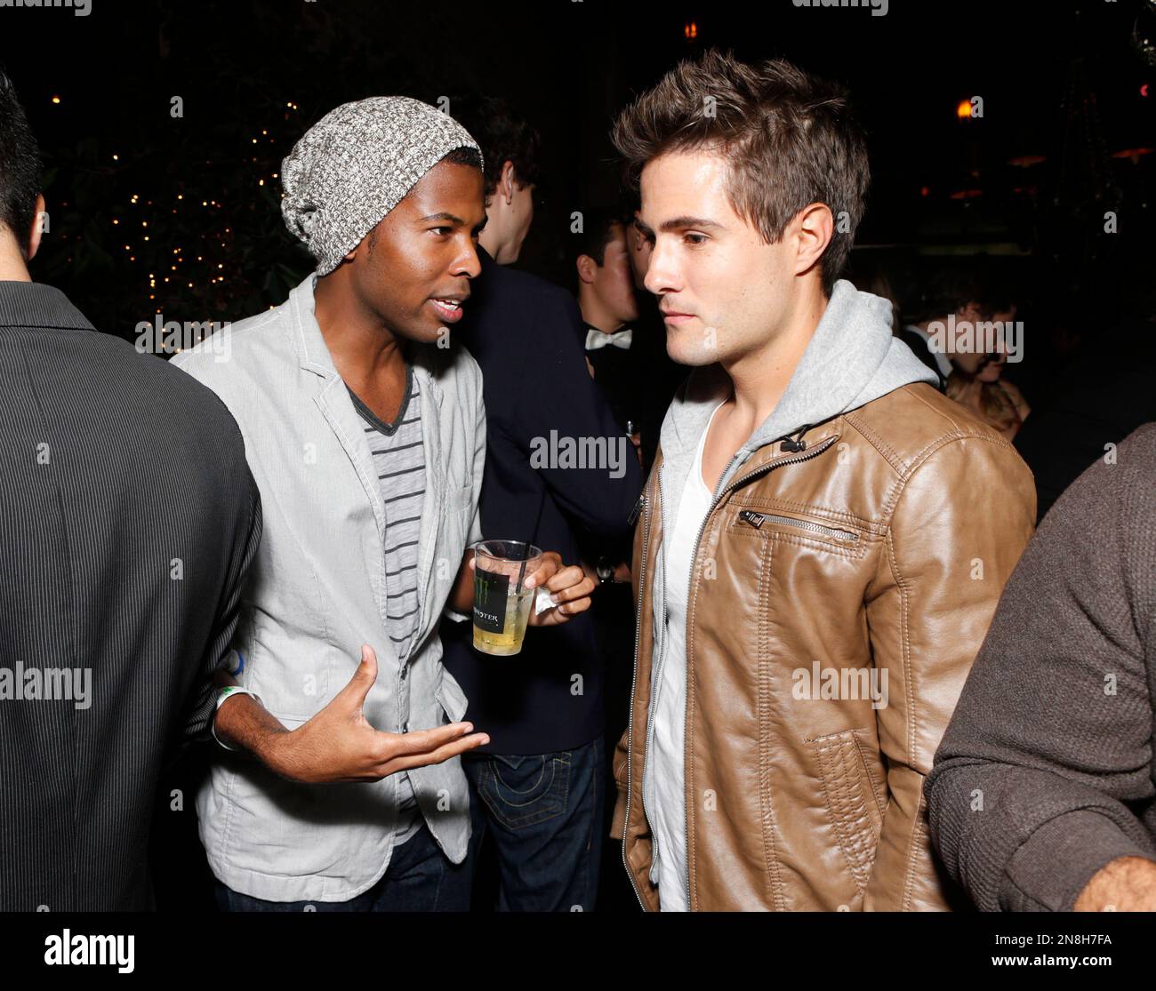 Paul Vandervort (right) and guest attend a surprise birthday party for ...