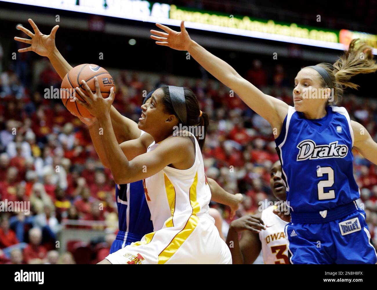 Iowa State guard Nikki Moody drives to the basket past Drake guard Mary ...