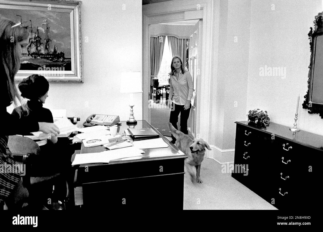 Susan Ford with Liberty the family dog leading the way make an exit ...