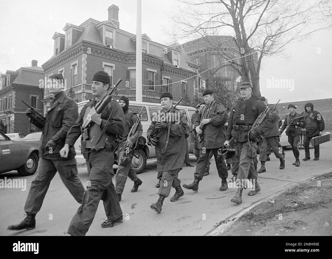 Members of the Massachusetts State Police "SWAT" team leave a prison ...