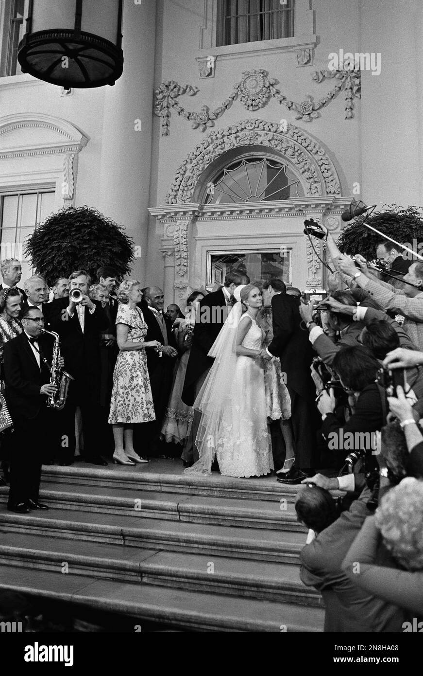 President Richard Nixon kisses his daughter, Tricia, as she and her ...