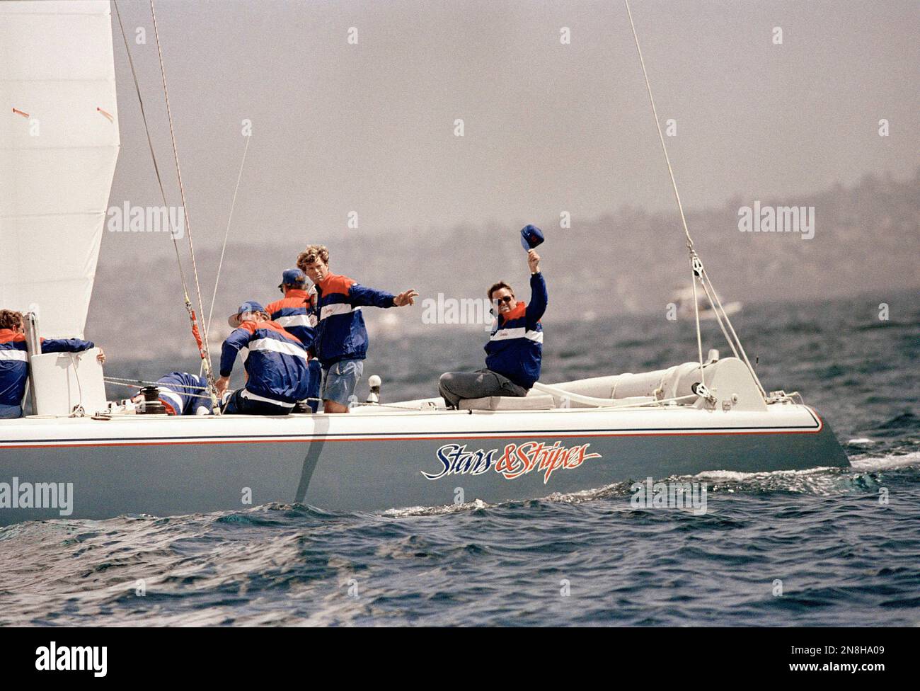 Stars and Stripes skipper Dennis Conner waves to spectators at the ...
