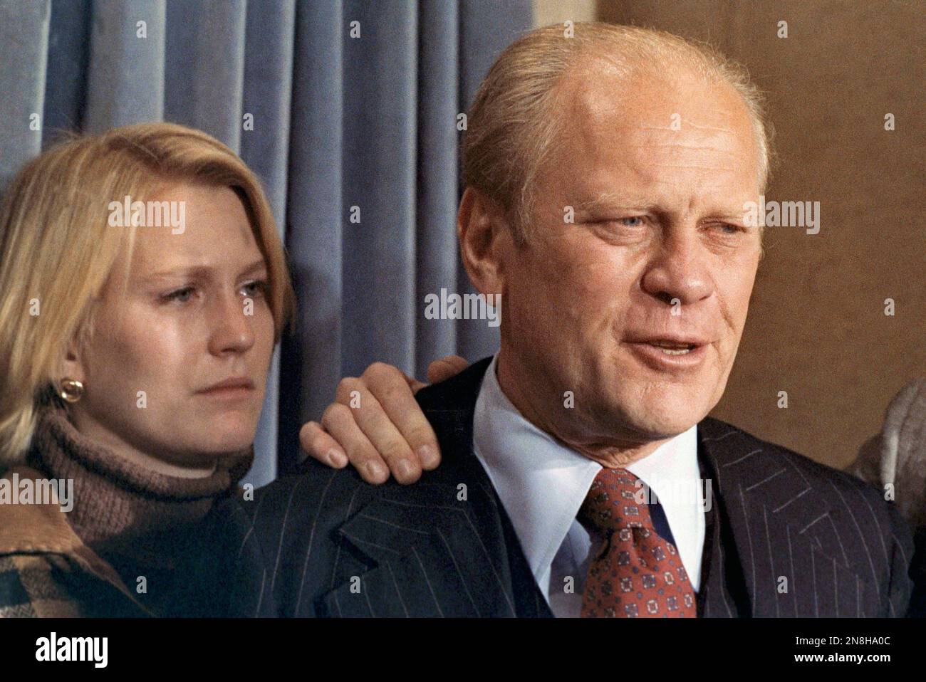 President Ford with his daughter Susan speaks to reporters in the White ...