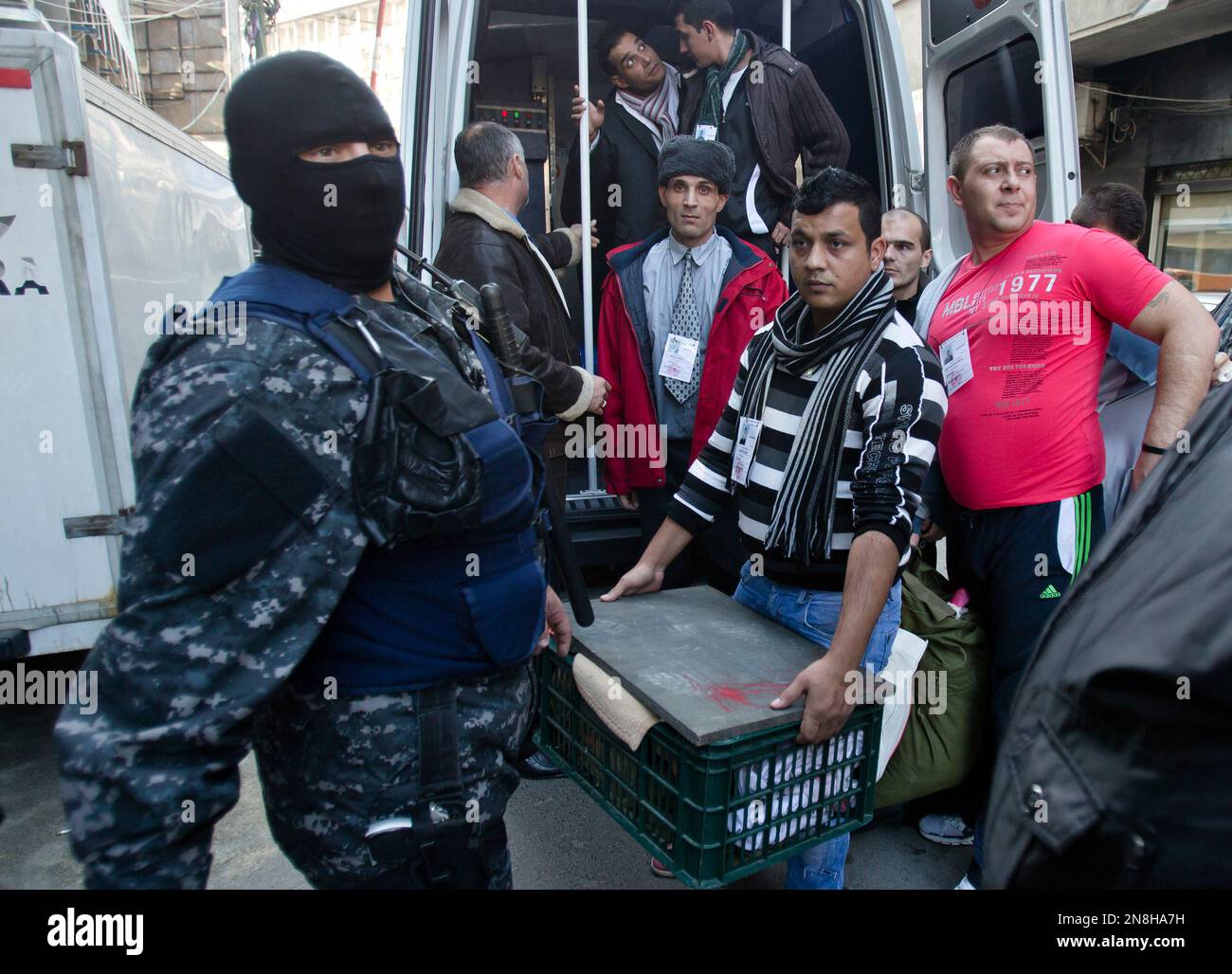 Inmates of the Arad penitentiary, western Romania, arrive under heavy ...