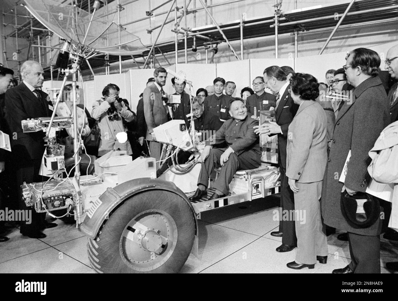 Chinese Vice Premier Deng Xiaoping sits in a model of the lunar rover ...
