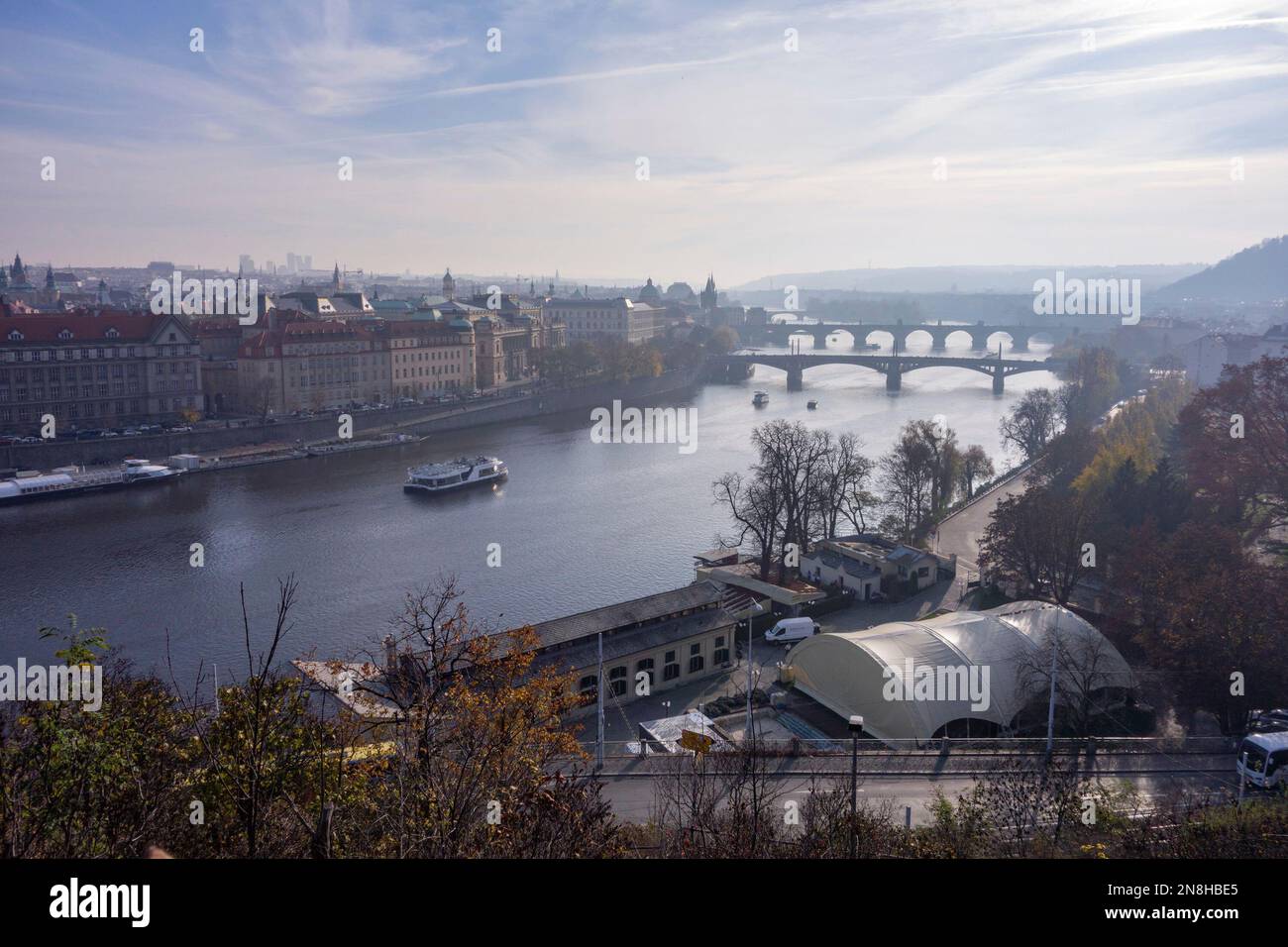 Panorama of Prague capital city in morning fog with Vltava bridges and ...